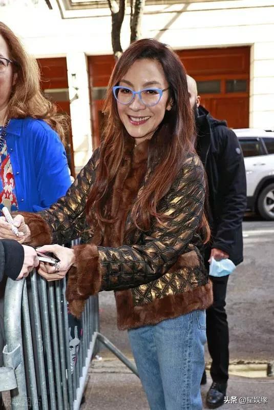 Michelle Yeoh is wearing a printed cotton jacket + jeans + leather ...