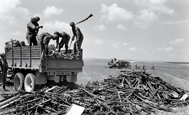 The German weapons and helmets seized by the U.S. Army in 1943 piled up ...