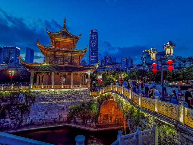 Jiaxiu Tower, a tourist landmark in Guiyang, built on the boulder in ...